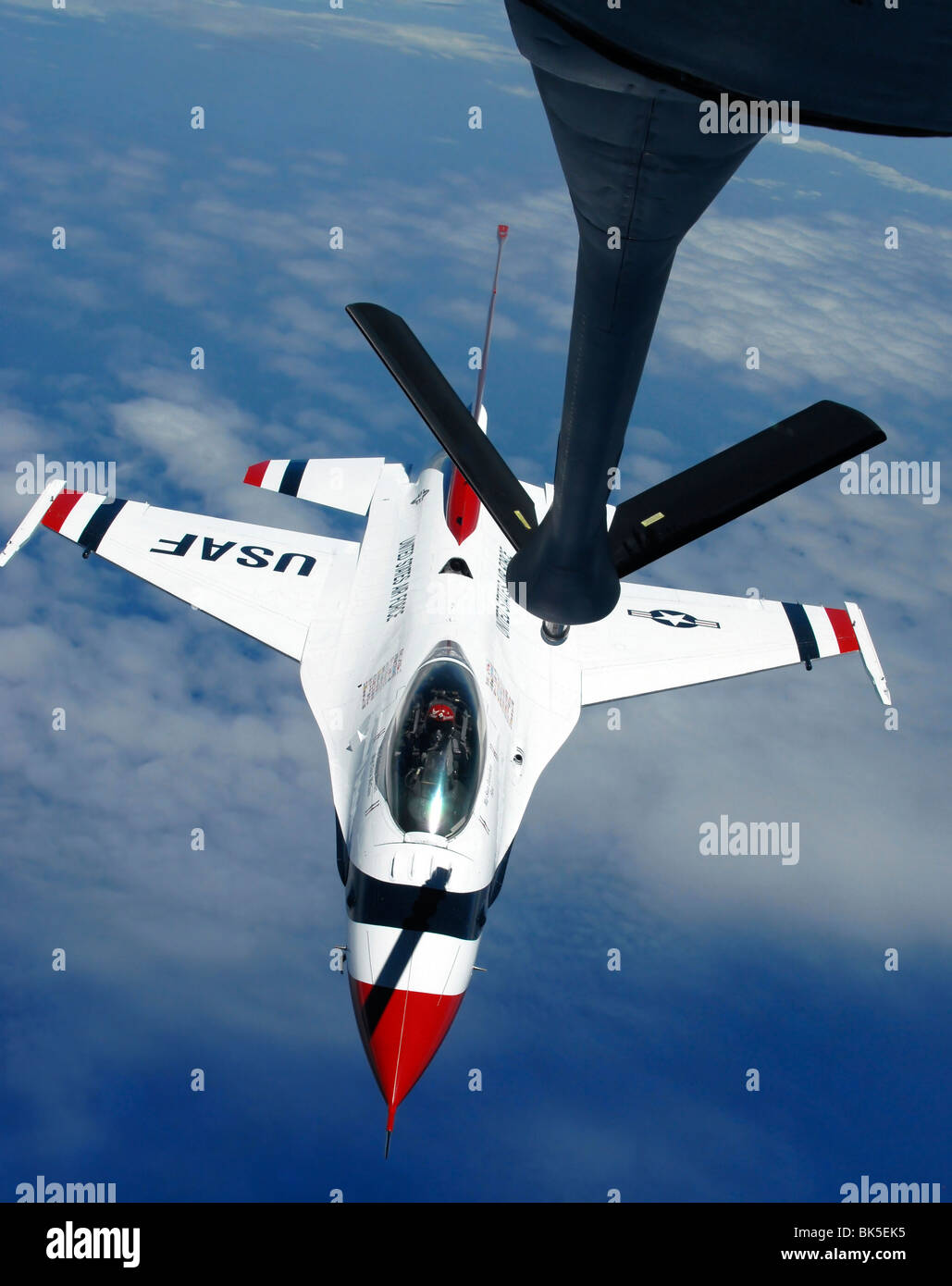 An Altus KC-135 Stratotanker refuels one of the eight Thunderbirds ...