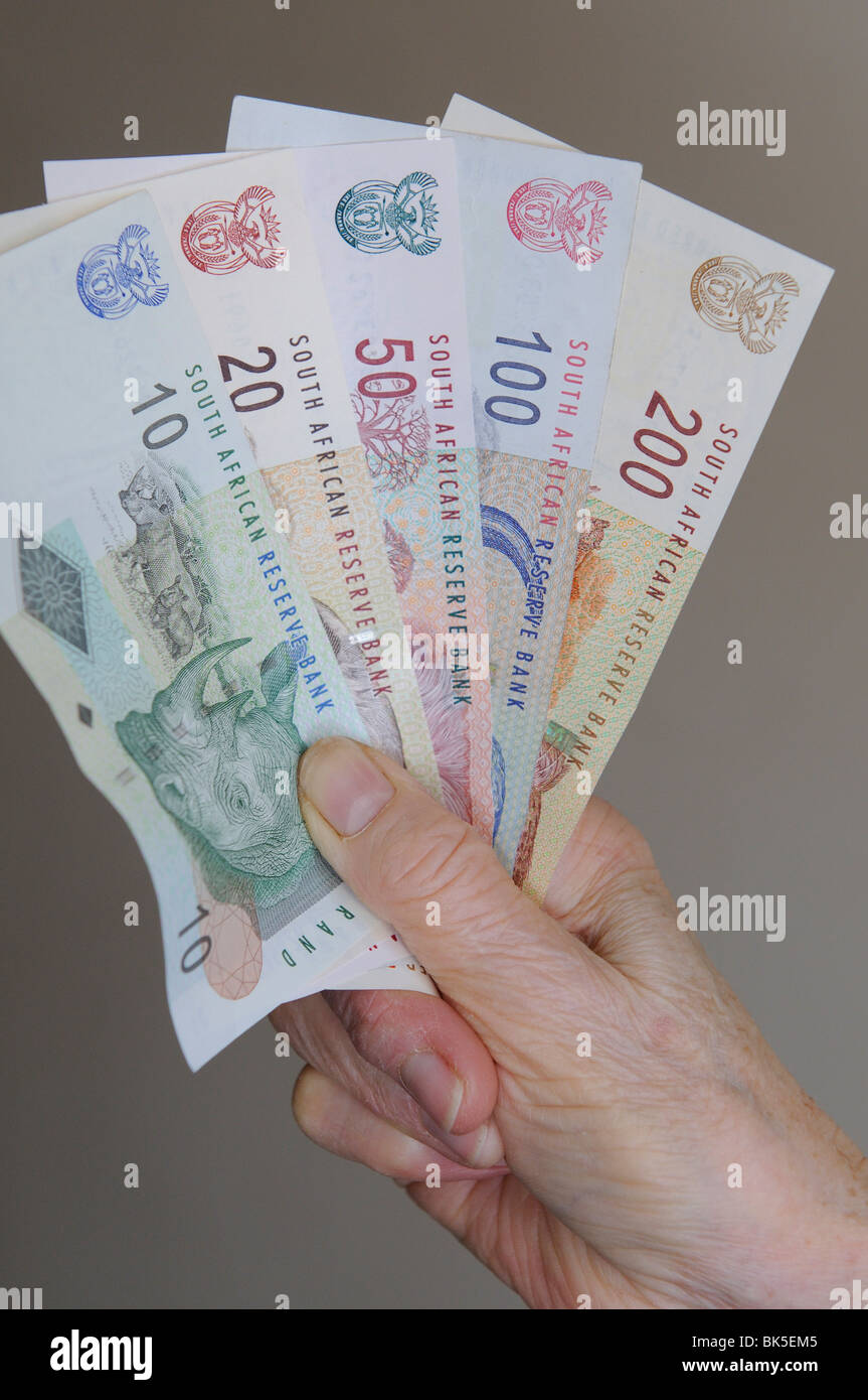Hand holding South African Rand banknotes Stock Photo - Alamy