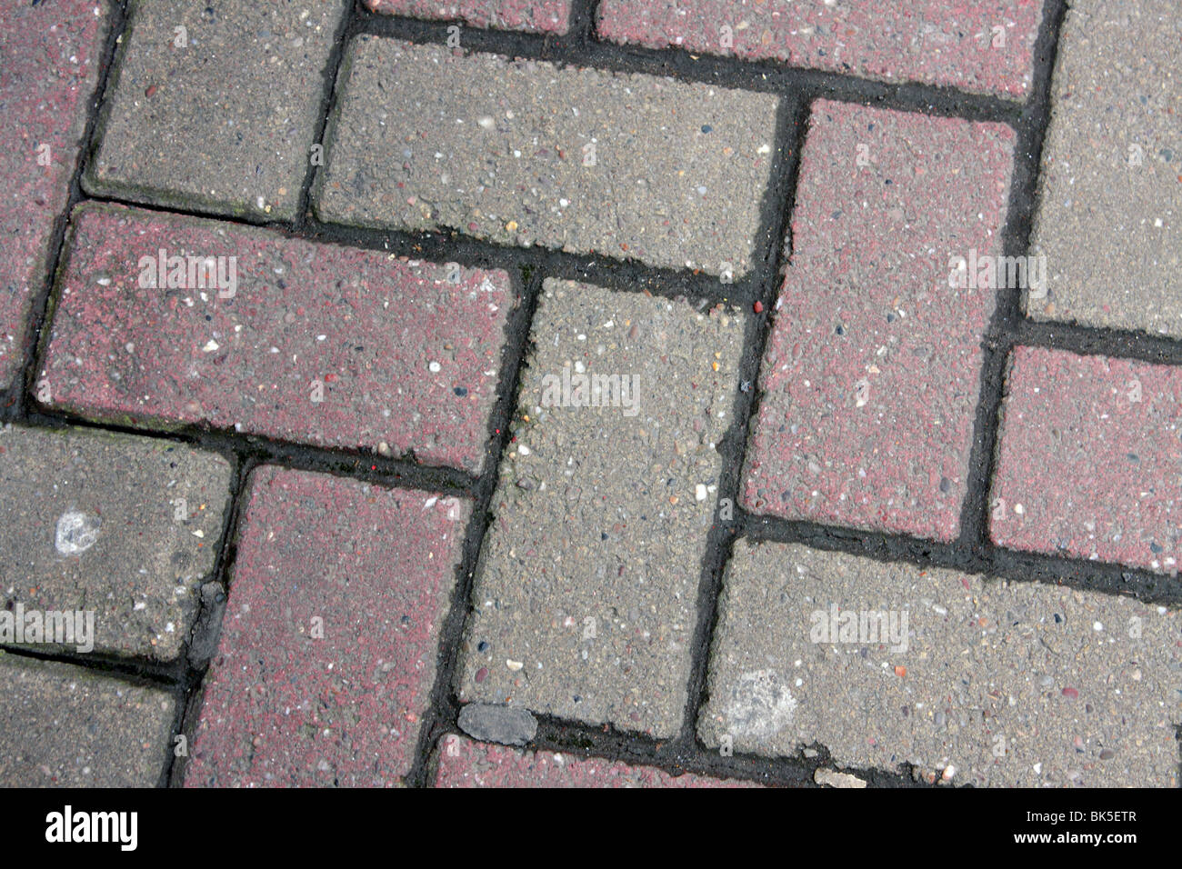 A section of pavement with chewing gum embedded on it Stock Photo - Alamy