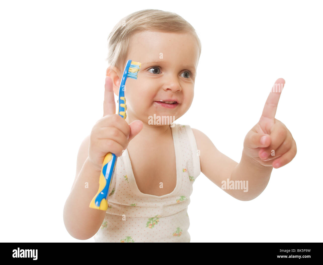 Studio portrait baby with toothbrush Stock Photo - Alamy