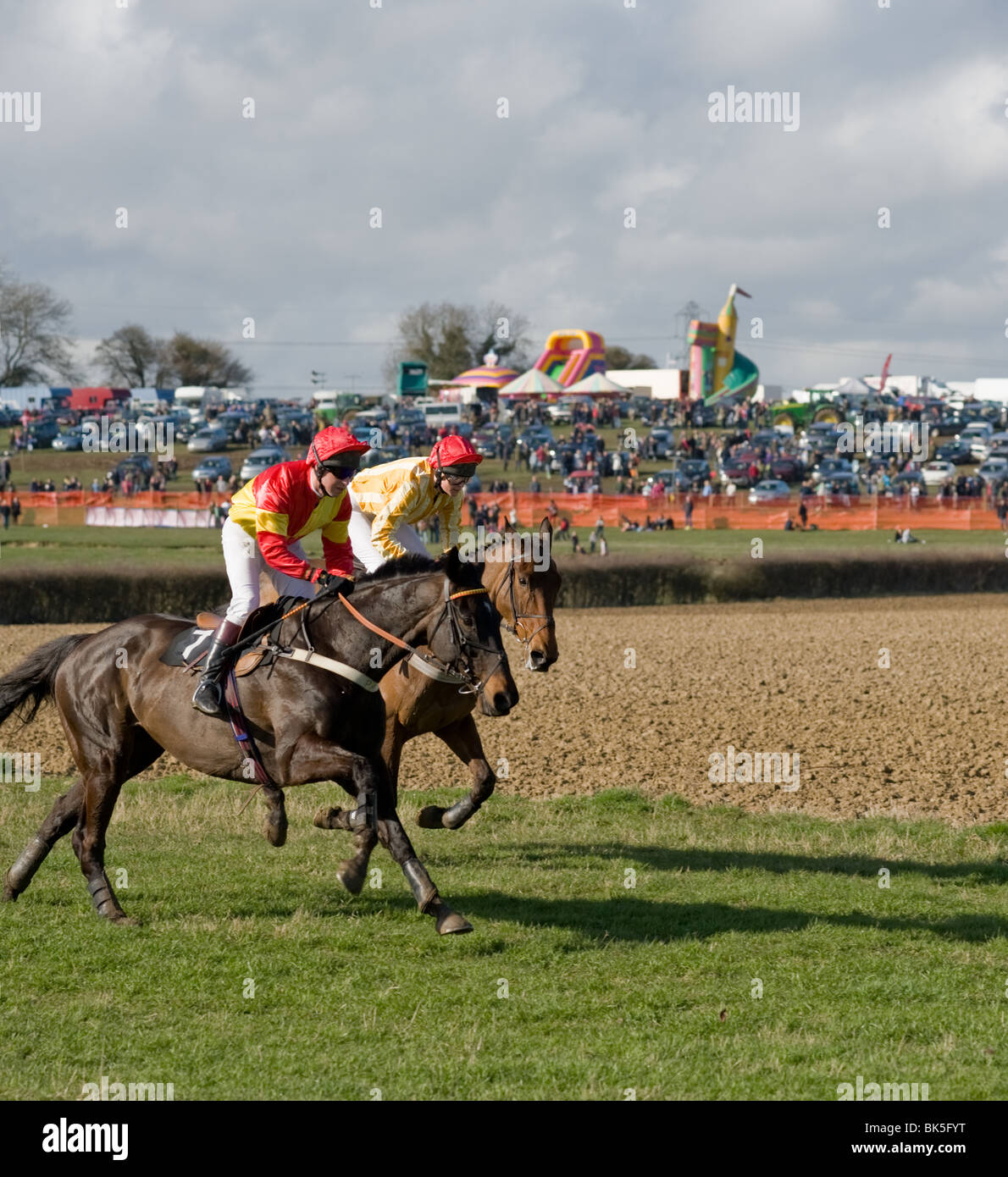 Two horses race at a poiunt to point event Stock Photo - Alamy