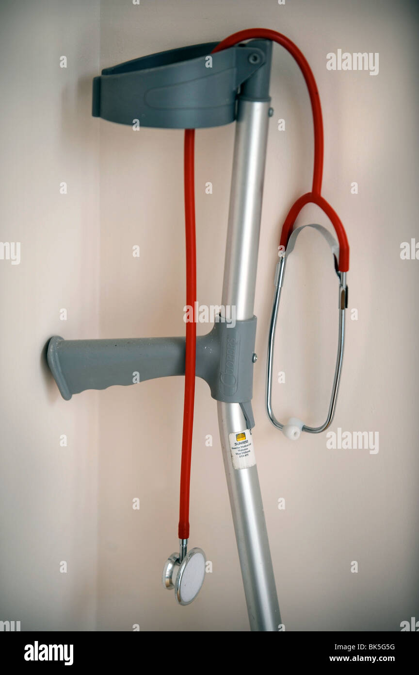 A hospital walking crutch and a doctor's stethoscope Stock Photo - Alamy