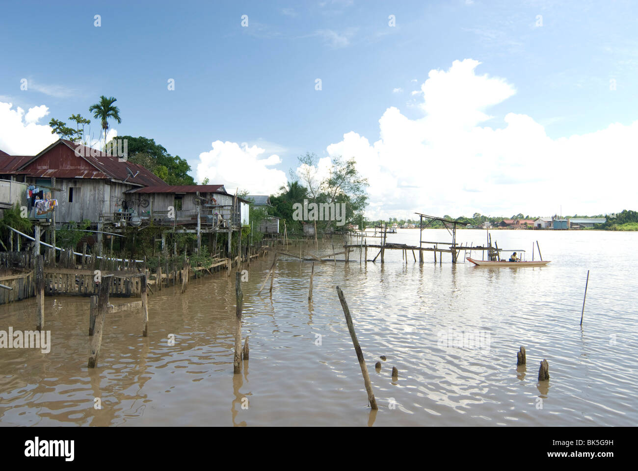 Village of stilted houses on banks of the Rejang River, Sarakei ...