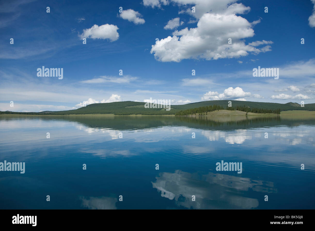 Reflection of clouds in a lake, Khatgal, Lake Khovsgol, Sayan Mountains ...