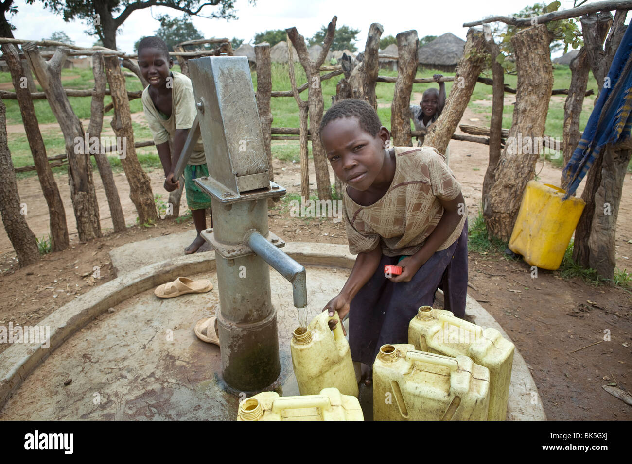 Children fetch fresh drinking water at a borehole in Amuria District ...