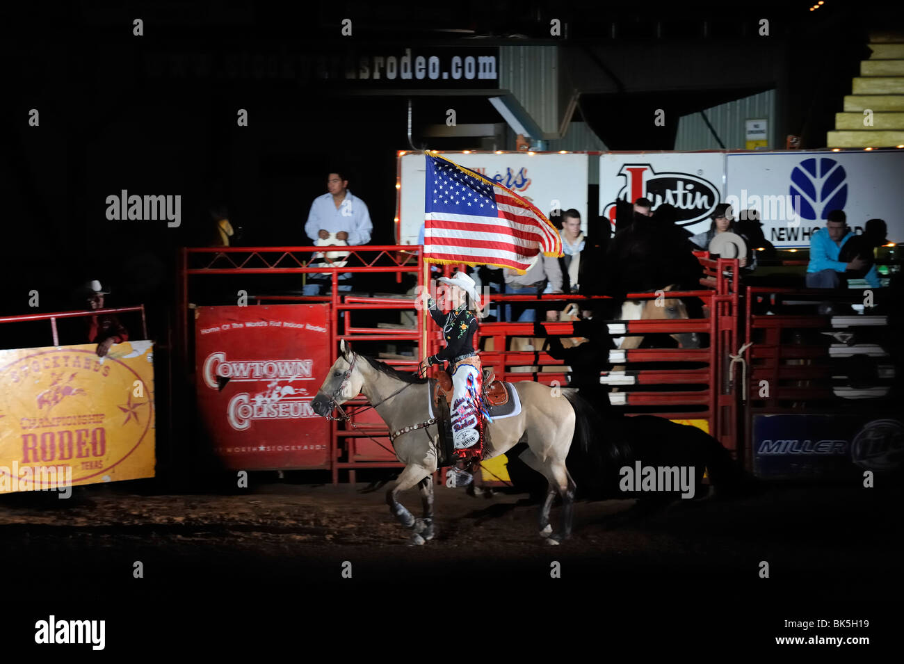 Woman rider carrying the American flag, Fort Worth, Texas Stock Photo ...