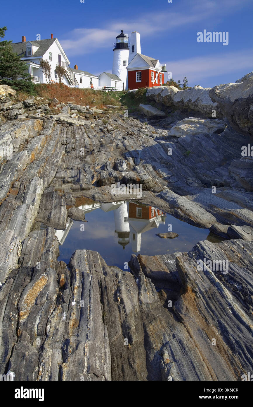Low angle view of Pemaquid Point Lighthouse reflected in tidal pool ...