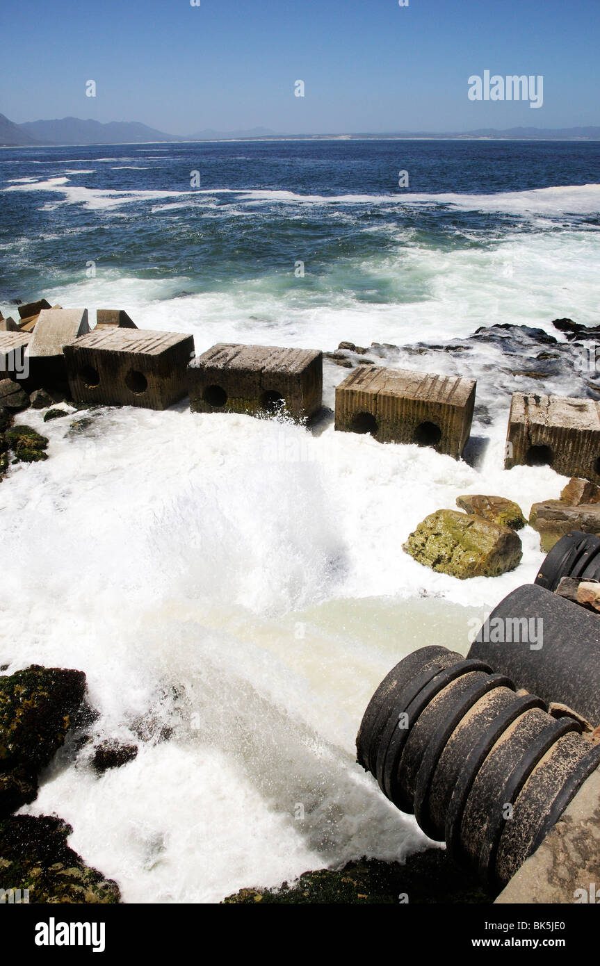 Outflow pipes discharging water into the sea at Hermanus a seaside ...