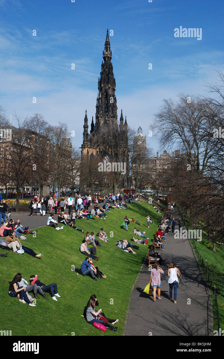 People enjoying the spring sunshine by the Scott Monument in Edinburgh ...