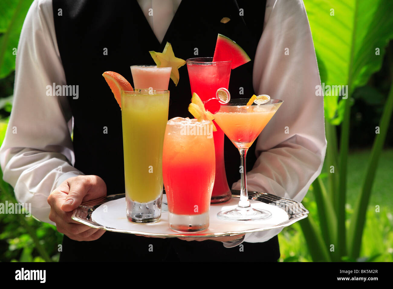 Waiter with tray of cocktails Stock Photo - Alamy