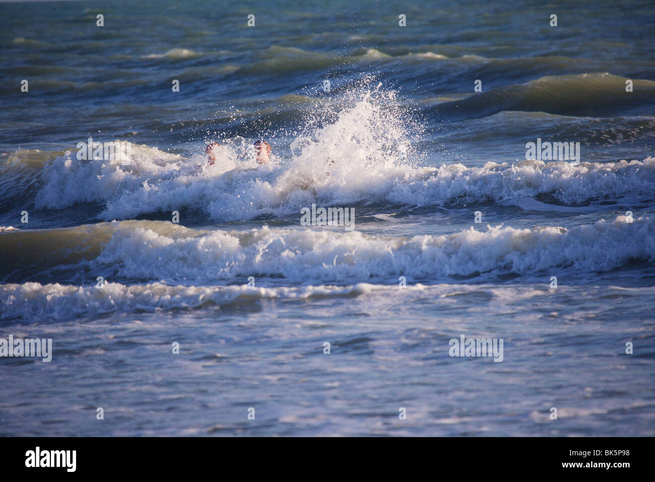 KIDS YOUTH ON SPRING BREAK BODY SURFING IN OCEAN Stock Photo - Alamy