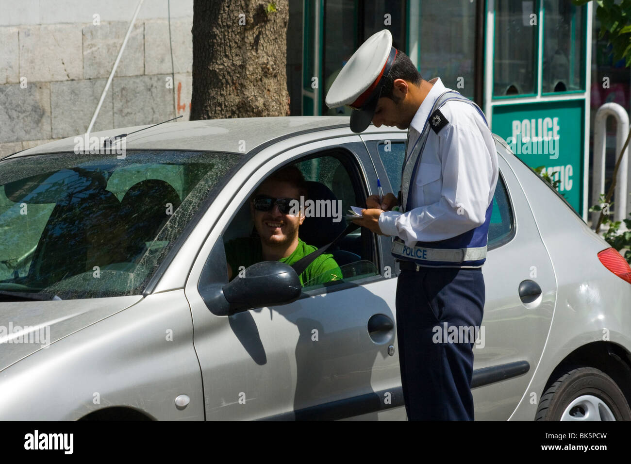 Police officer writing ticket traffic hi-res stock photography and ...