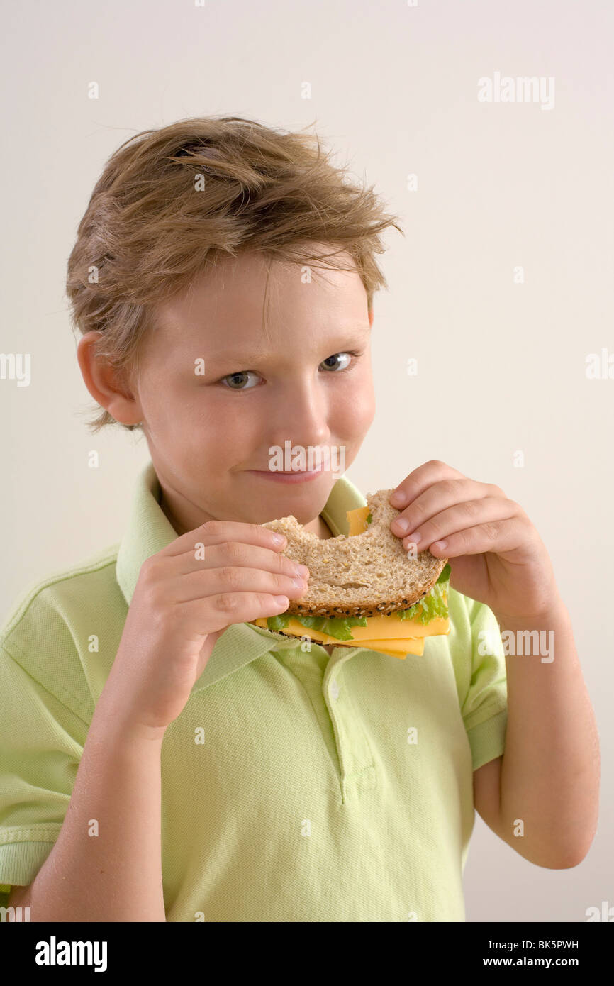 Little Boy Eating a Sandwich Stock Photo - Alamy