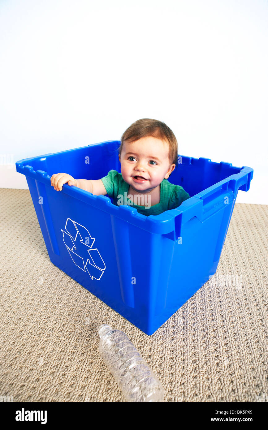 Baby Girl in Recycling Bin Stock Photo - Alamy