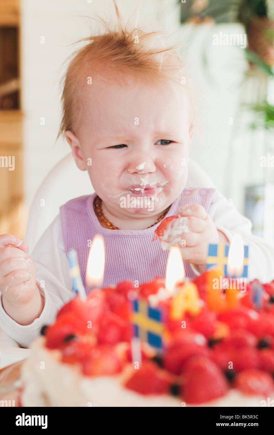 Baby Girl Eating Cake Stock Photo - Alamy