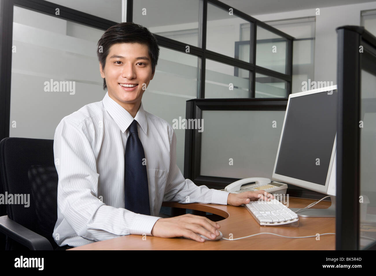 Office worker using the computer Stock Photo - Alamy