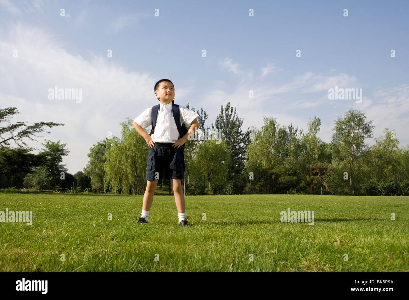 Elementary school student in the park Stock Photo - Alamy