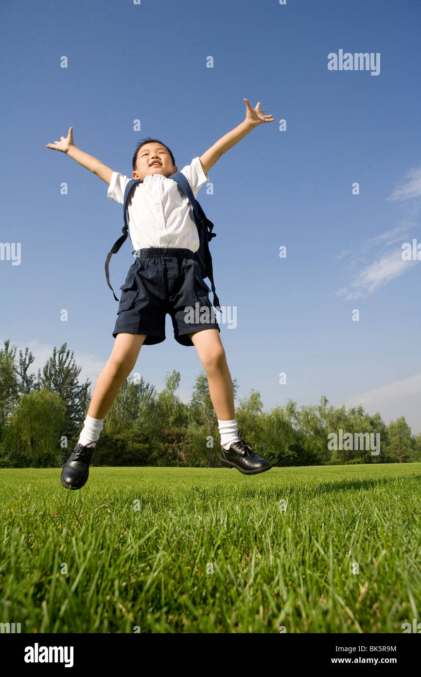 Elementary school student in the park Stock Photo - Alamy