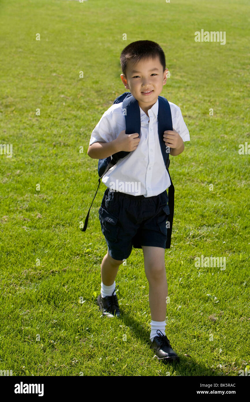 Elementary school student in the park Stock Photo - Alamy