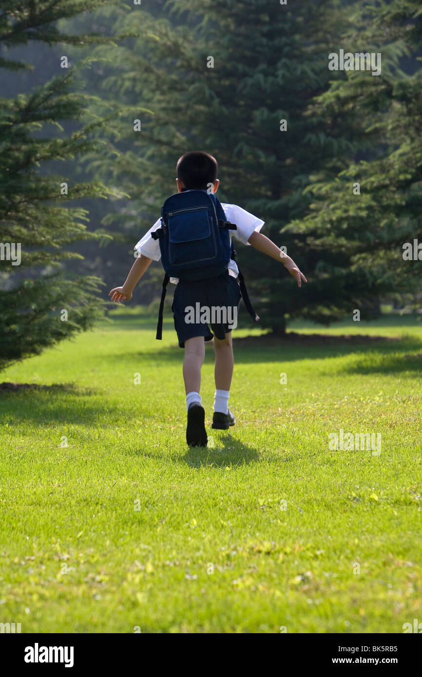 Elementary school student in the park Stock Photo - Alamy