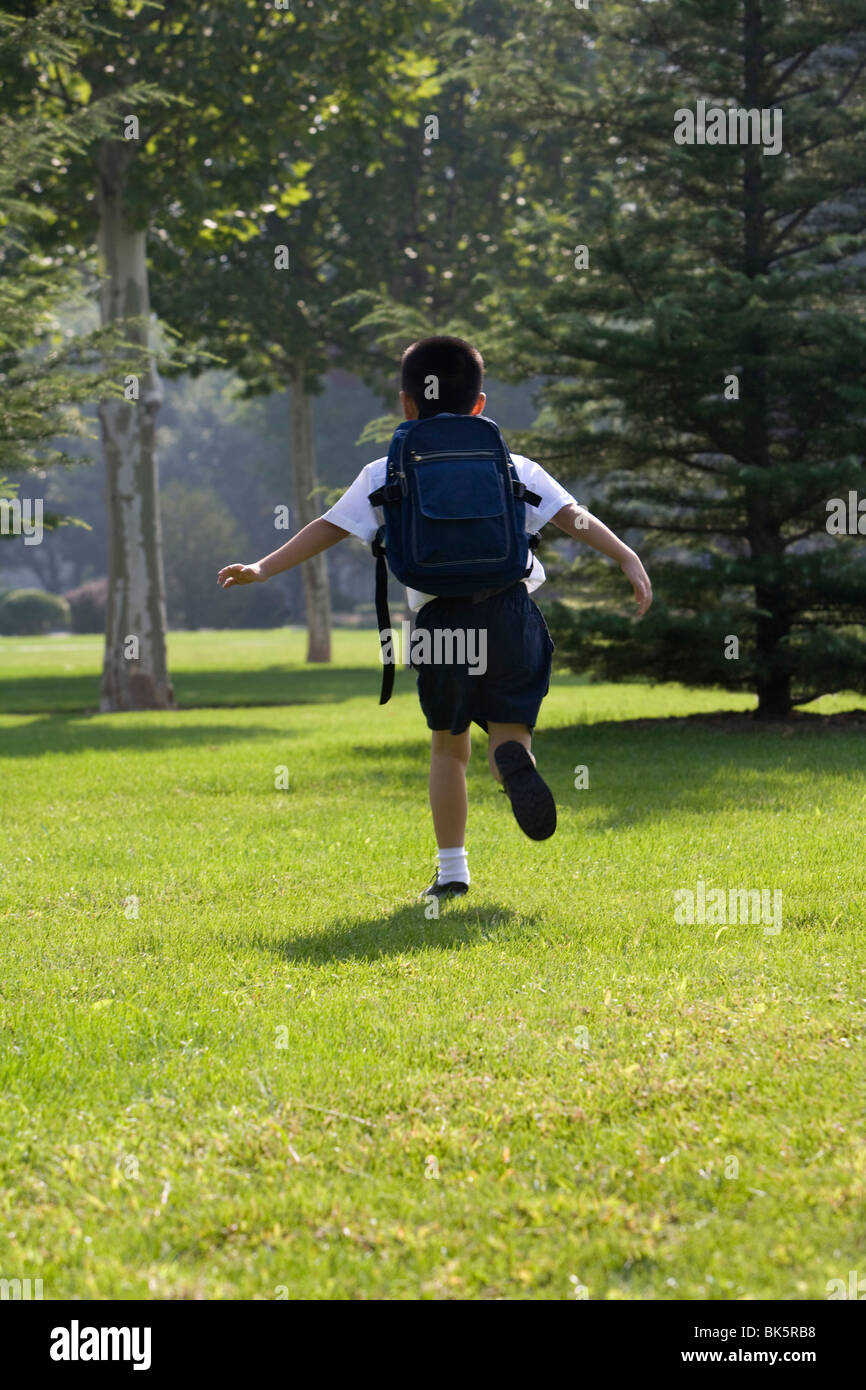 Elementary school student in the park Stock Photo - Alamy