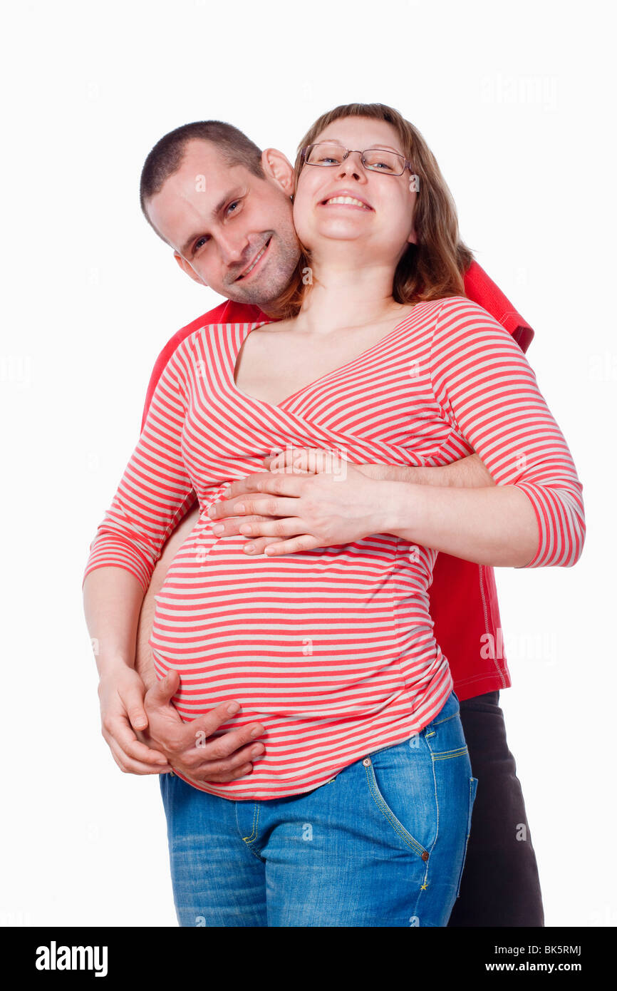 happy expecting couple holding each other - isolated on white Stock ...