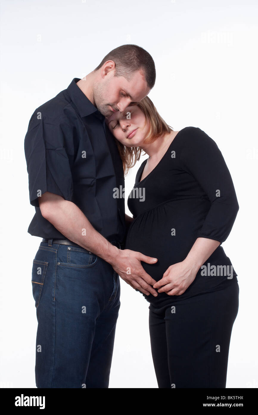 happy expecting couple holding each other - isolated on white Stock ...