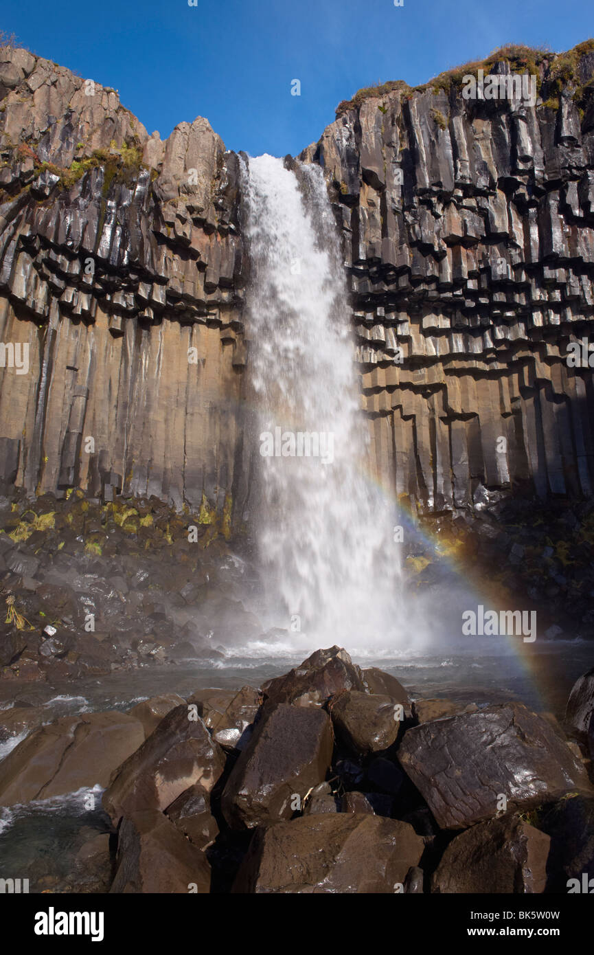 Svartifoss (Black Falls) waterfall, with overhanging black basalt ...