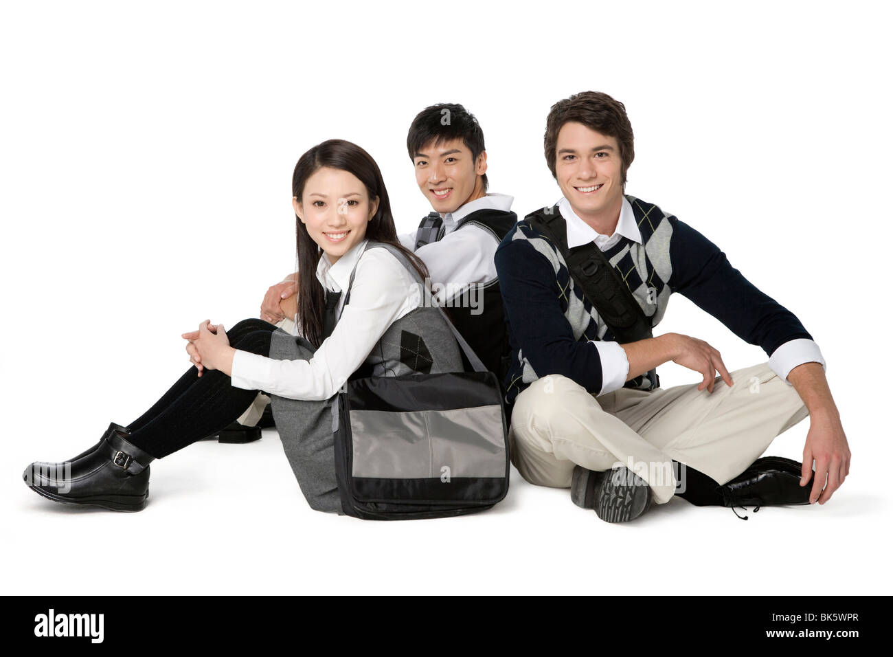 Students sitting on the floor Stock Photo - Alamy