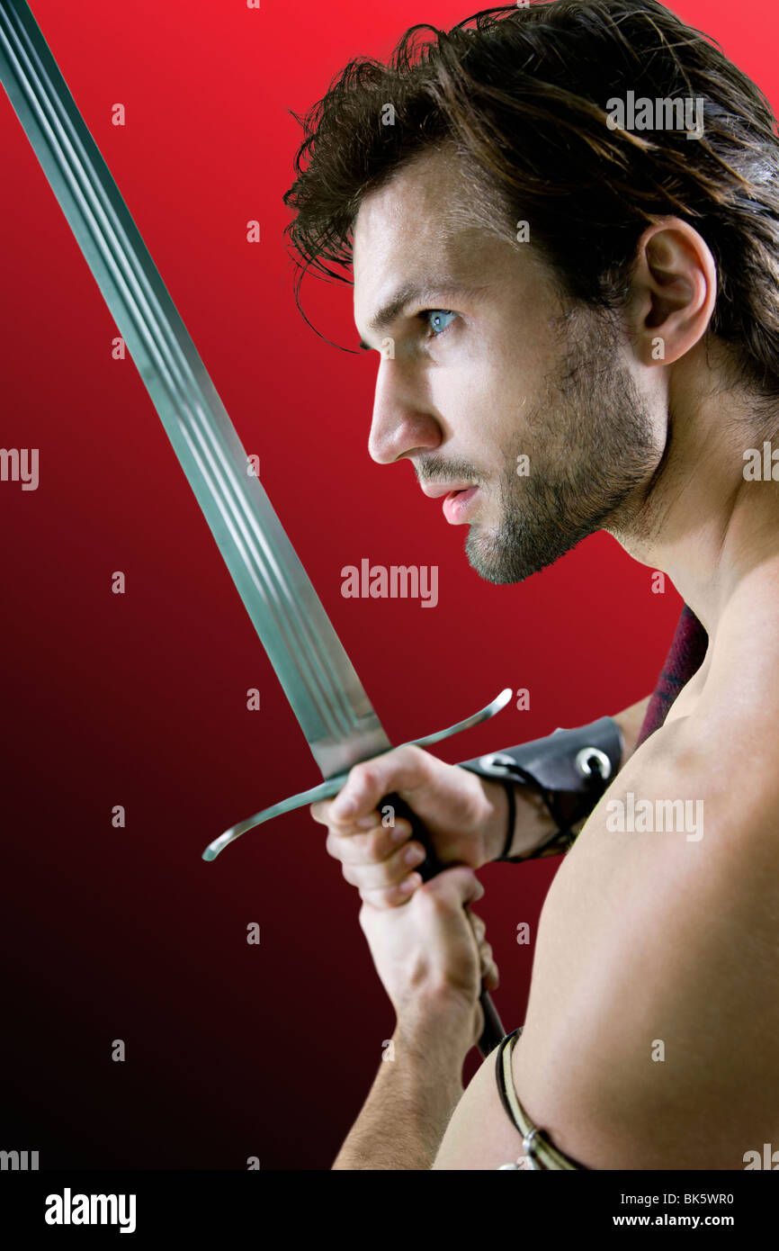 Man holding sword hi-res stock photography and images - Alamy