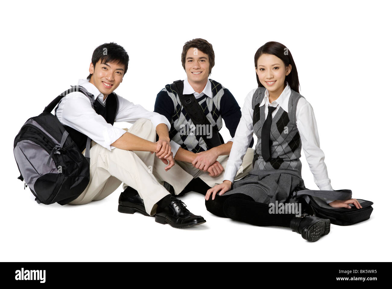 Students sitting on the floor Stock Photo - Alamy