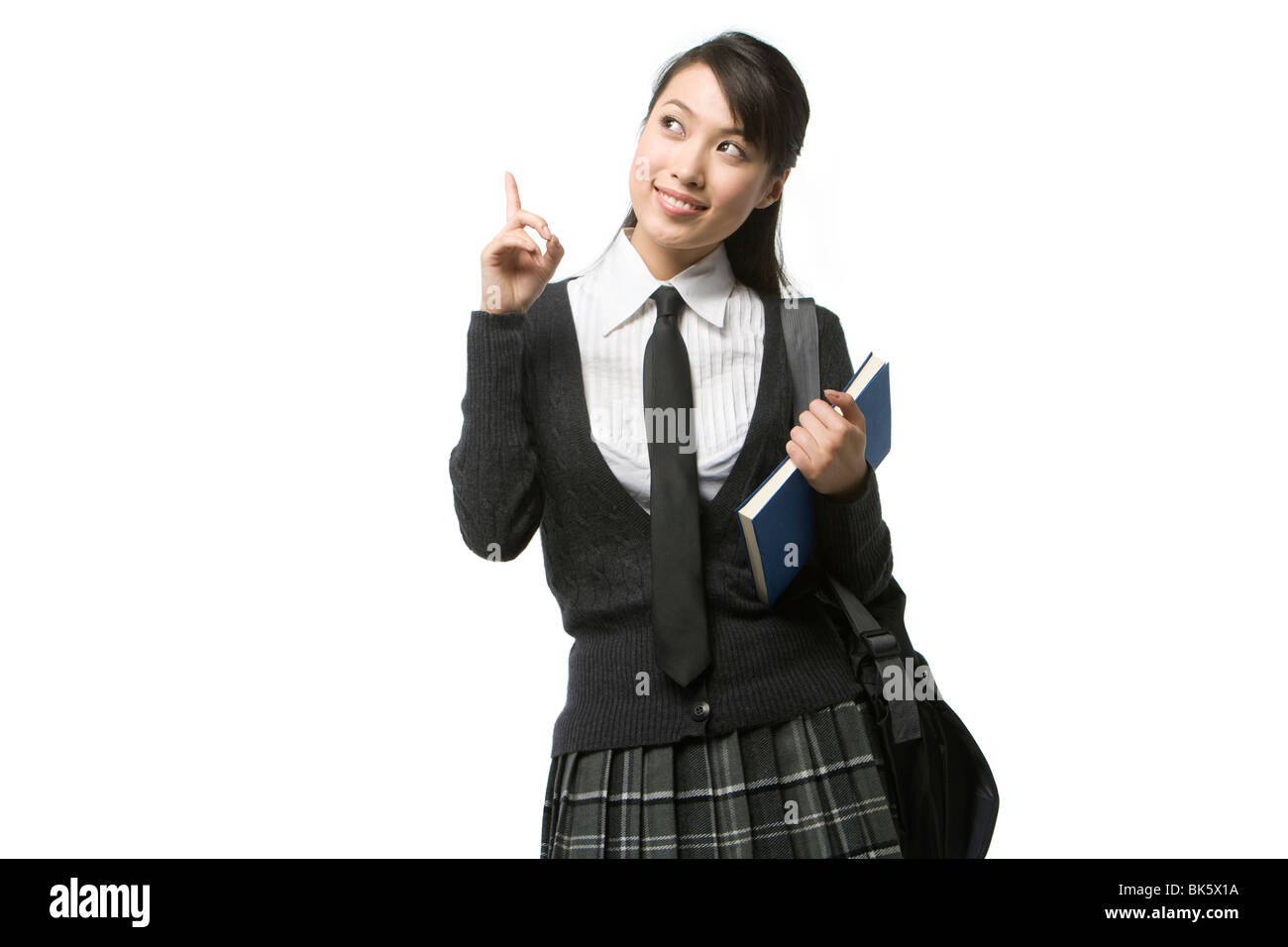 Schoolgirl holding her books Stock Photo - Alamy