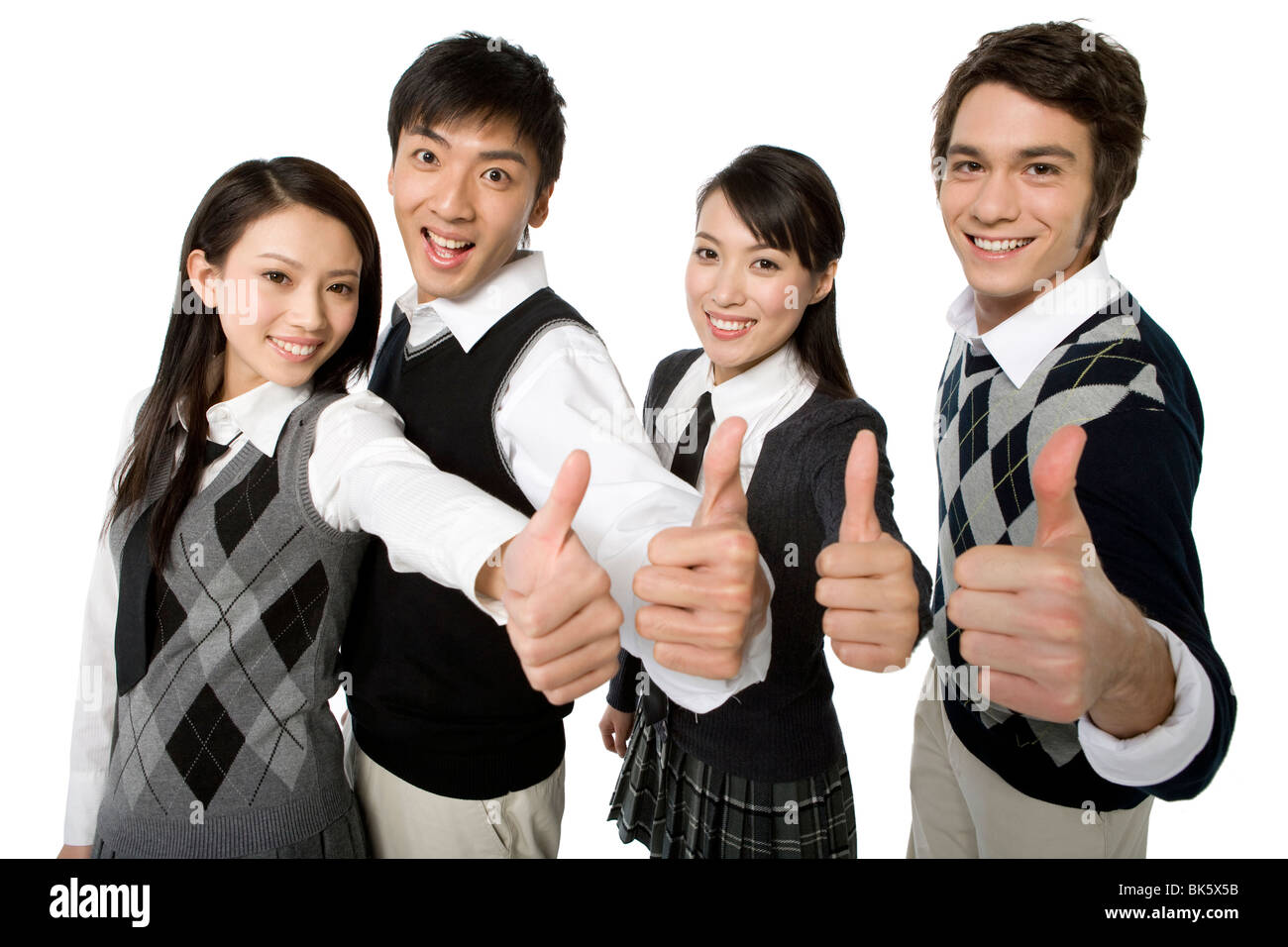 Students give thumbs up Stock Photo - Alamy