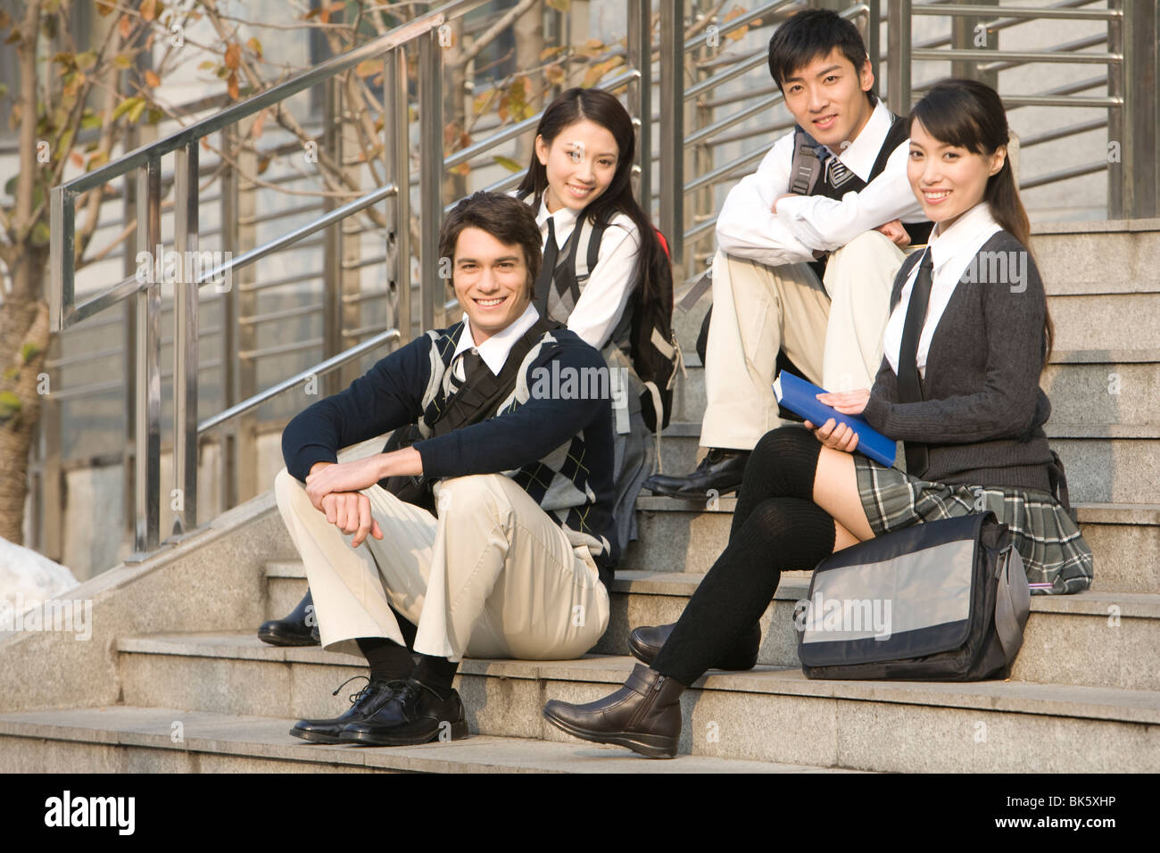 Students on the steps Stock Photo - Alamy