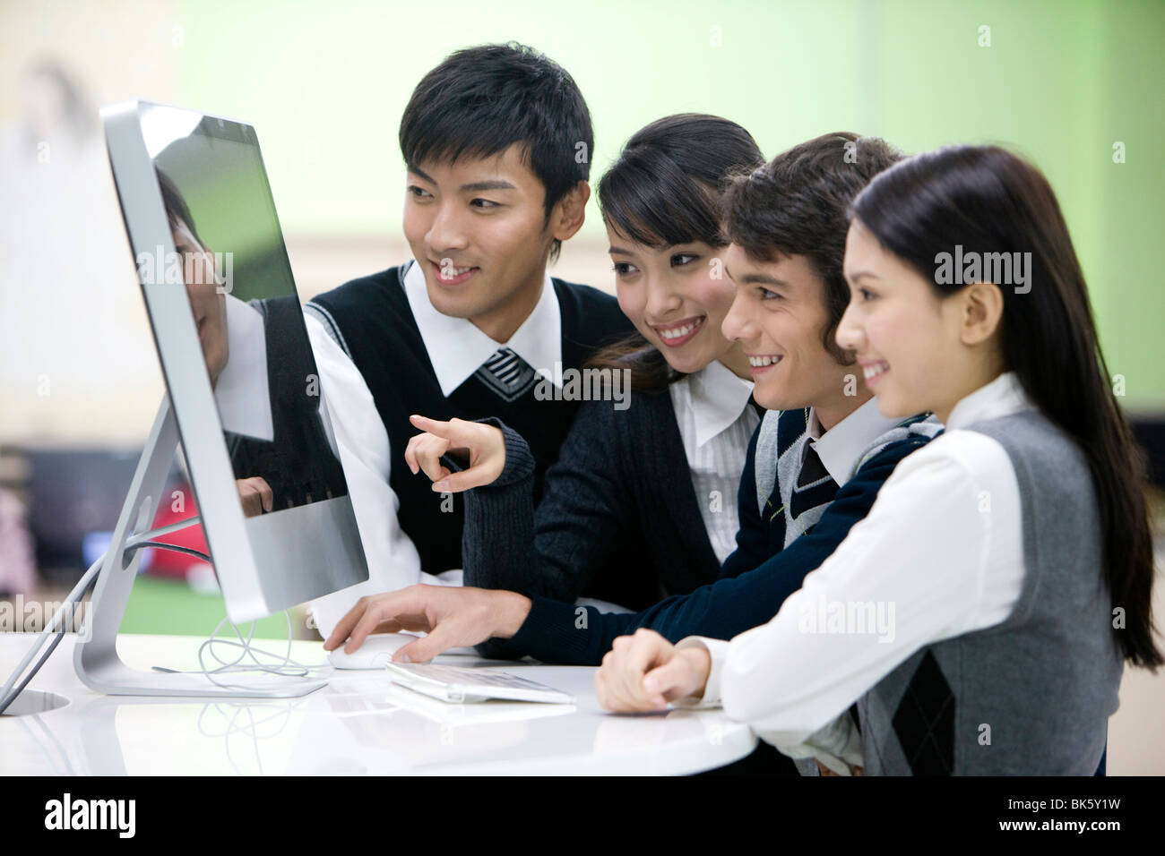 Young women students using computer lab hi-res stock photography and ...