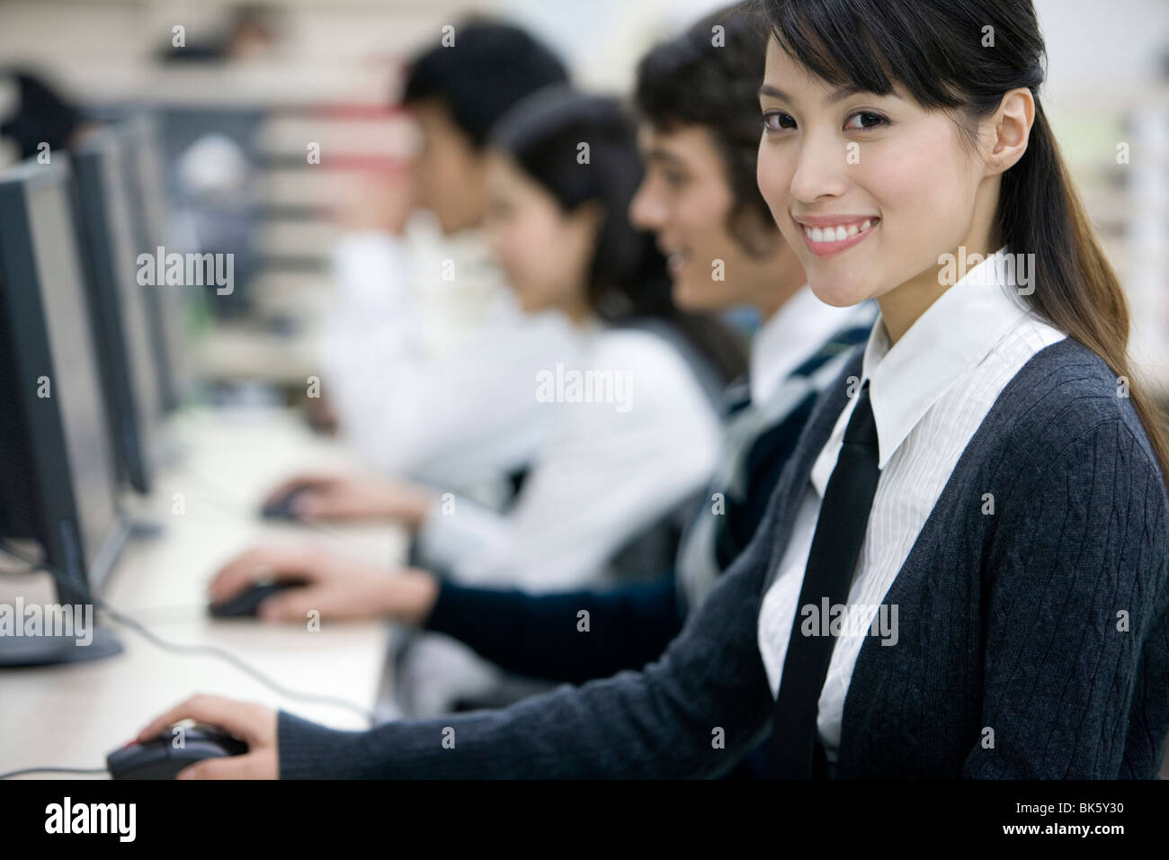 Young women students using computer lab hi-res stock photography and ...