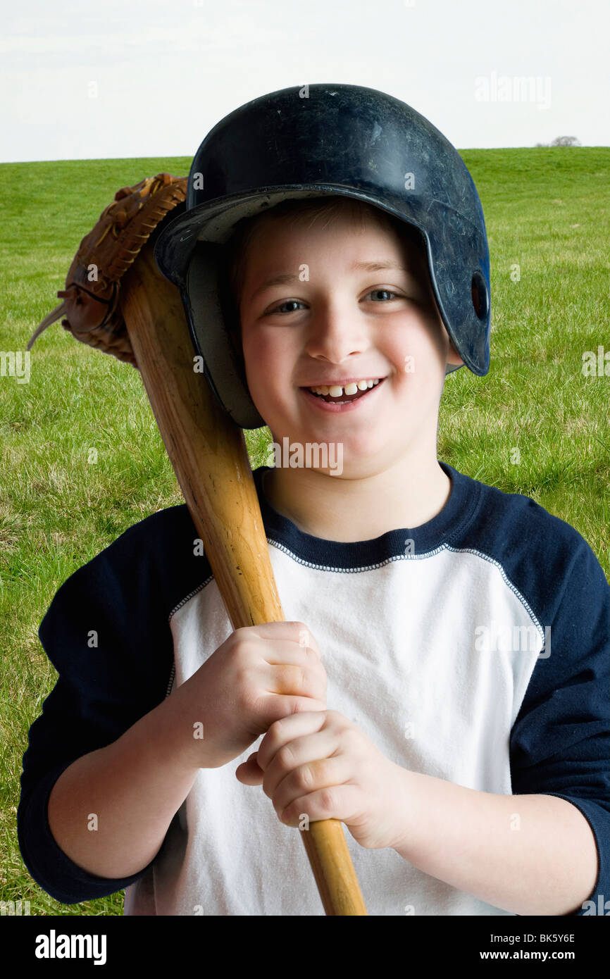 Boy holding a baseball bat Stock Photo - Alamy