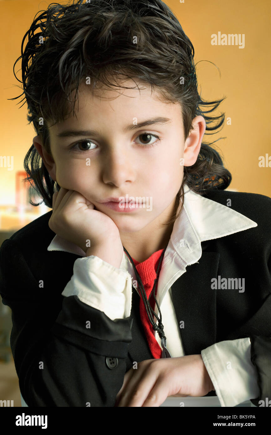 Close-up of a boy looking sad Stock Photo - Alamy