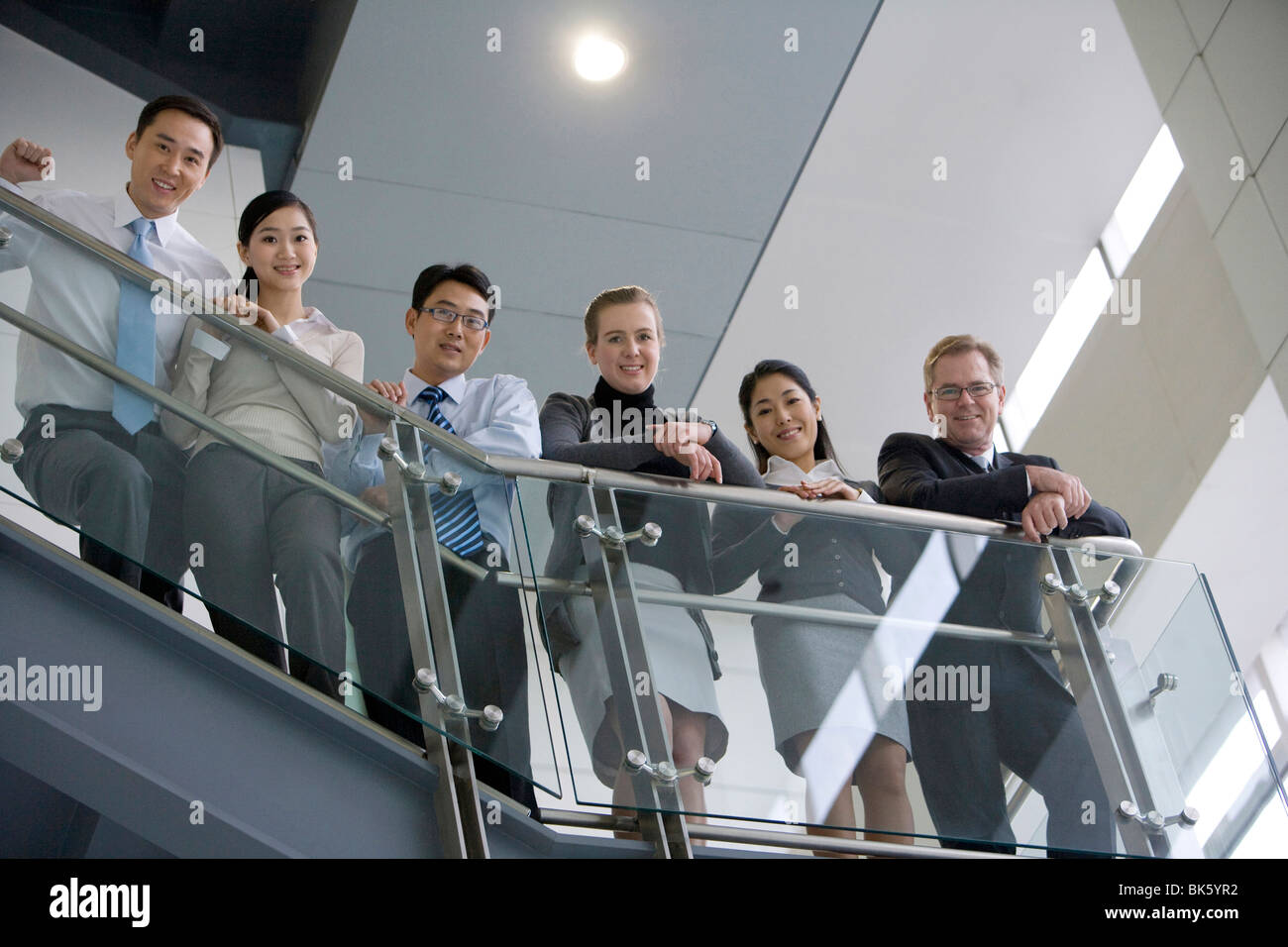 Officemates on the stairs Stock Photo - Alamy