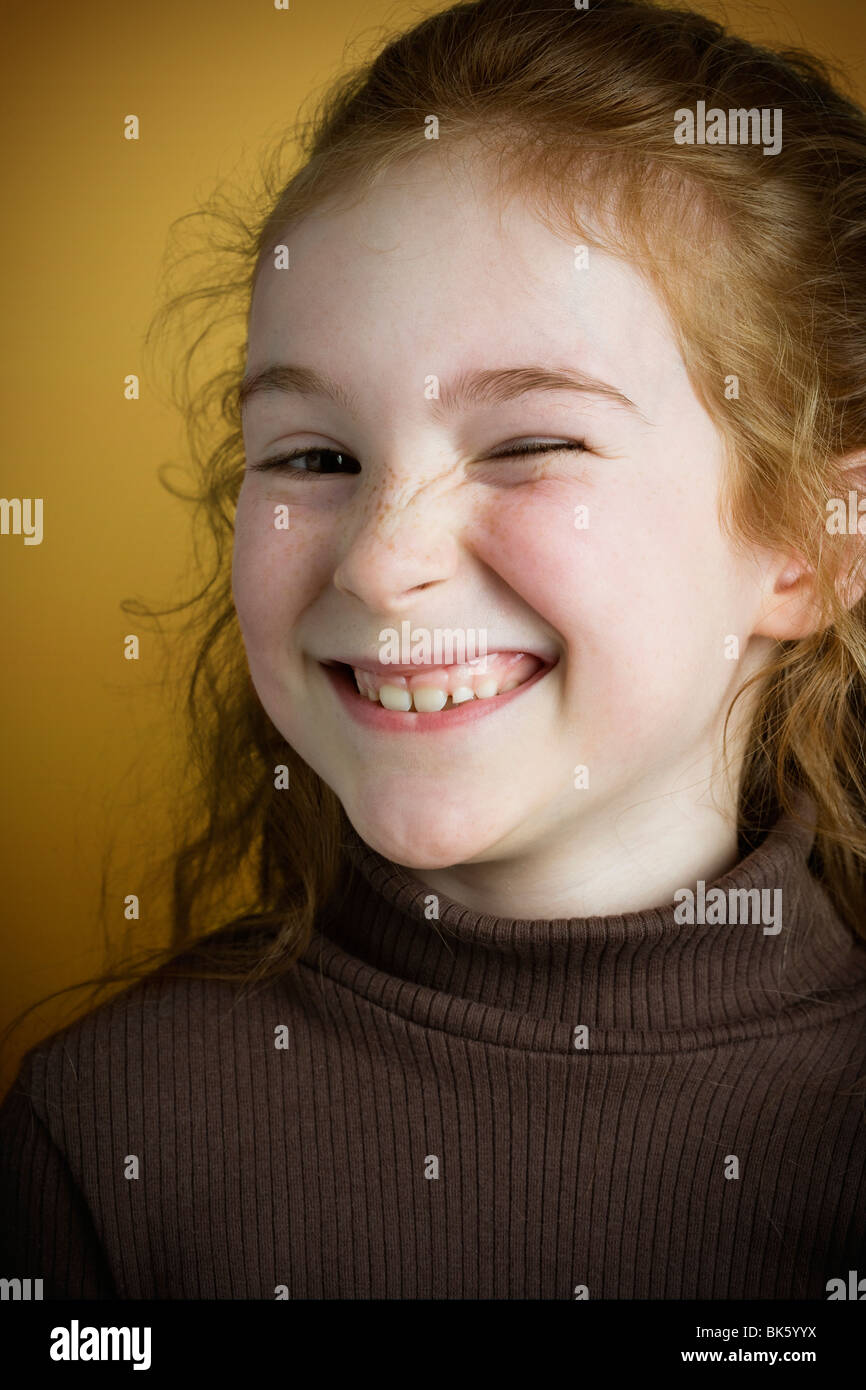 Close-up of a girl winking Stock Photo - Alamy