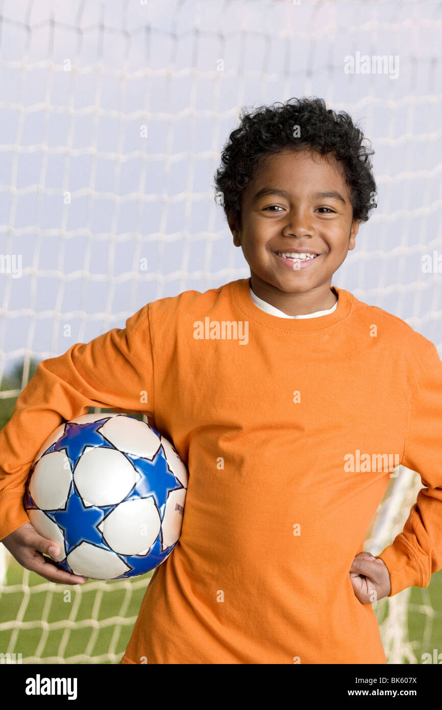Boy holding a soccer ball Stock Photo - Alamy Boy holding a soccer ball Stock Photo - Alamy