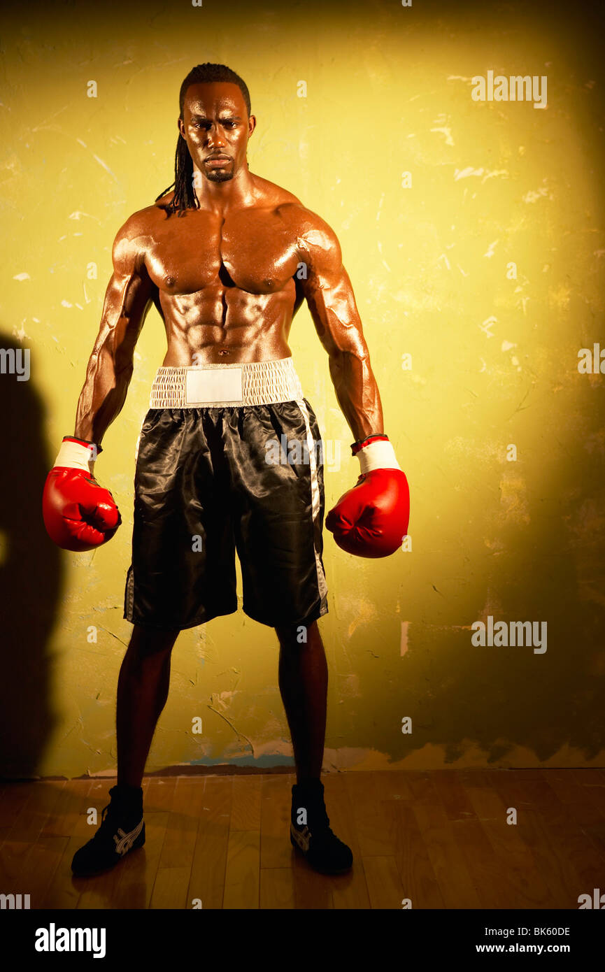 Boxer posing with boxing gloves Stock Photo - Alamy