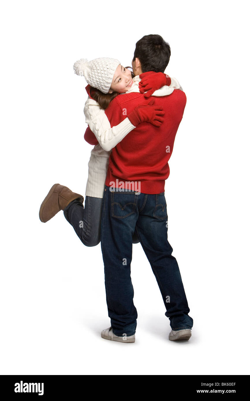Young couple embracing Stock Photo - Alamy