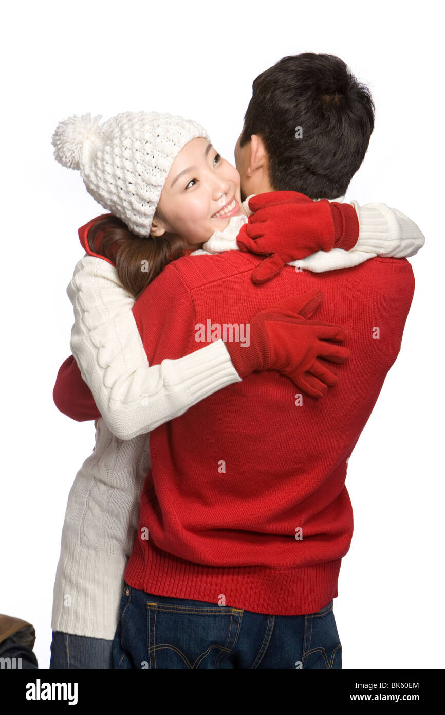 Young couple embracing Stock Photo - Alamy