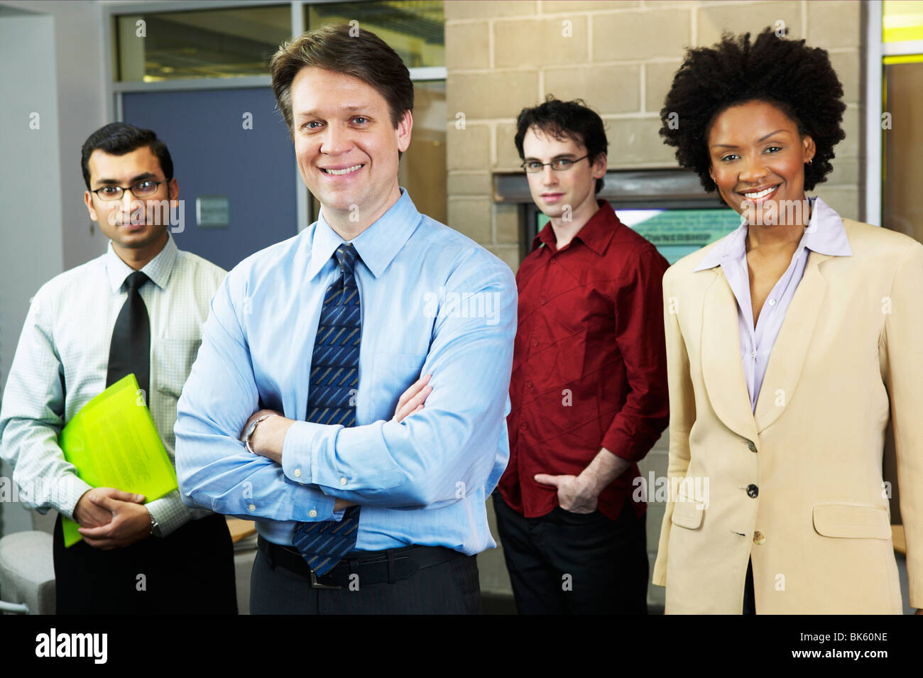 Business executives standing in an office Stock Photo - Alamy