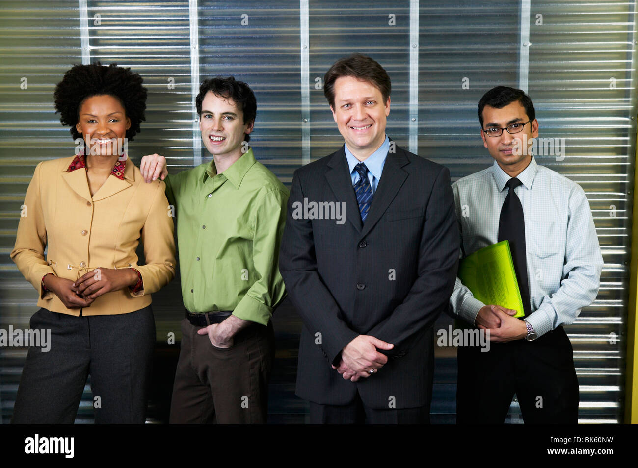 Business executives standing in an office Stock Photo - Alamy