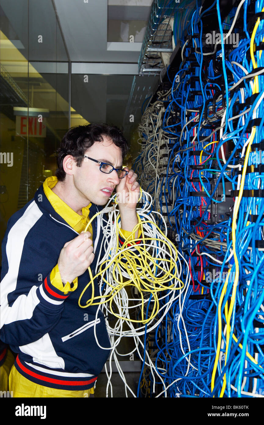 Technician working in a server room Stock Photo - Alamy