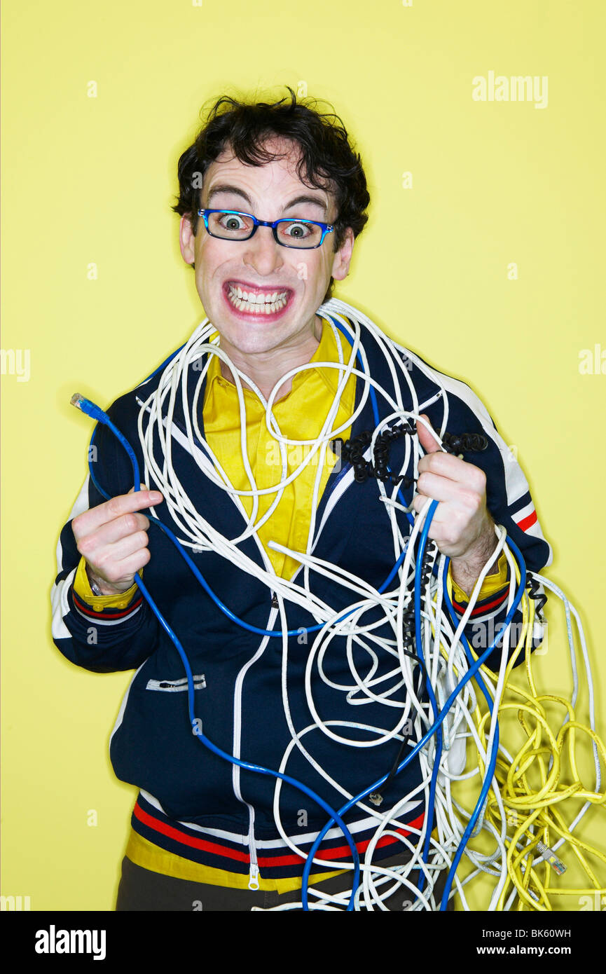 Technician tangled in computer cables Stock Photo - Alamy