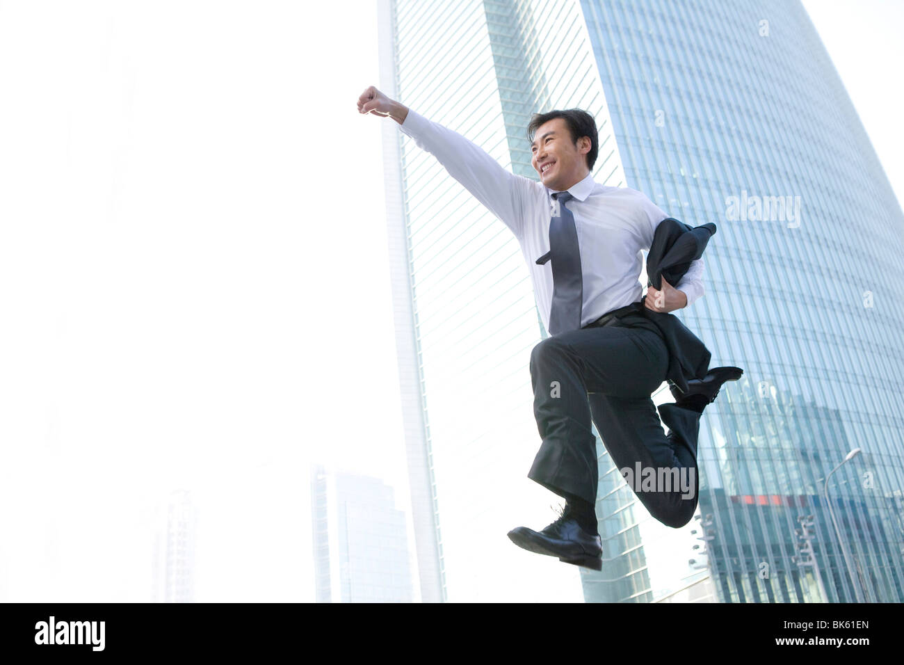 Man expressing success jumping on hi-res stock photography and images ...