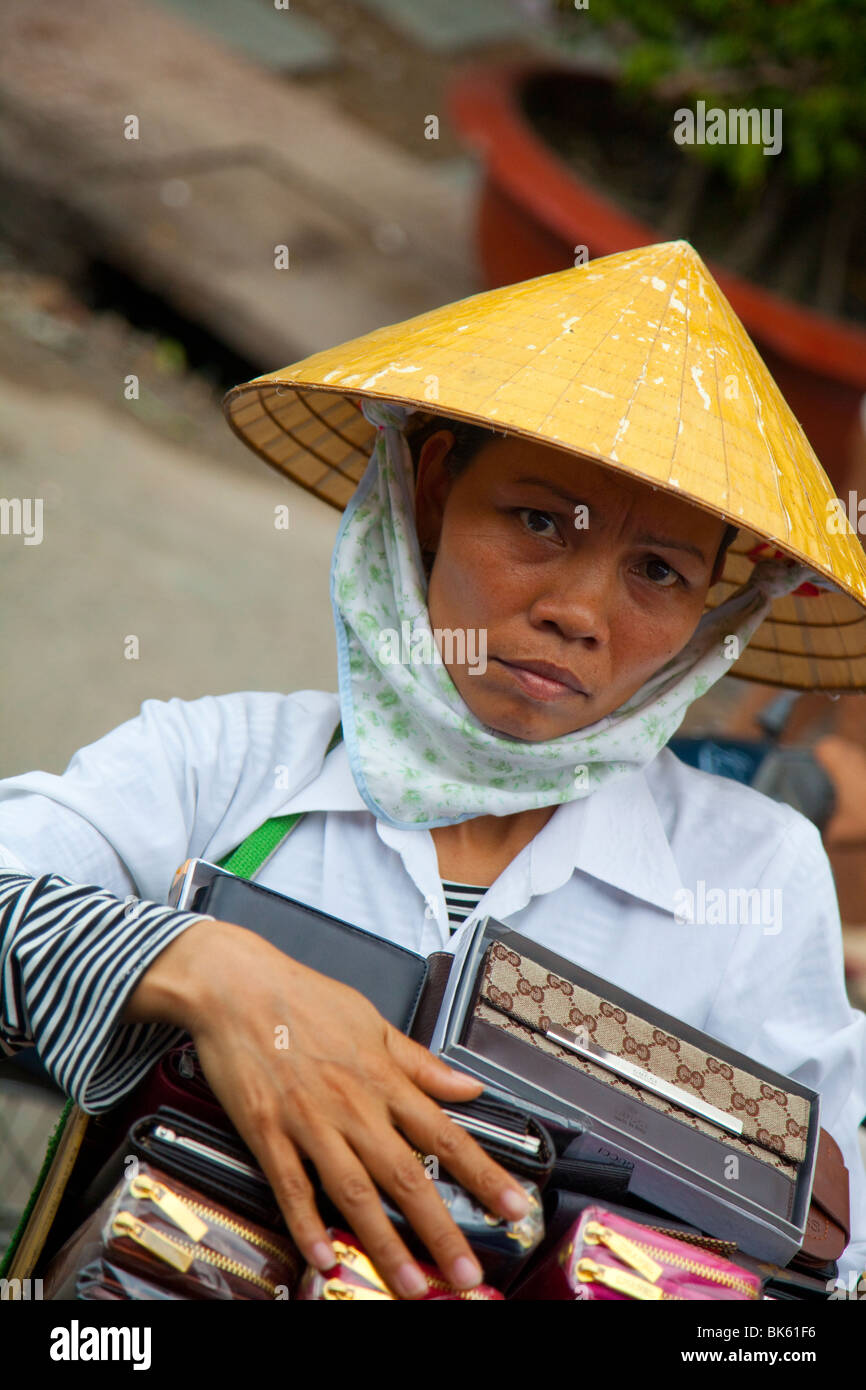 Lady from Saigon selling her wares Stock Photo - Alamy
